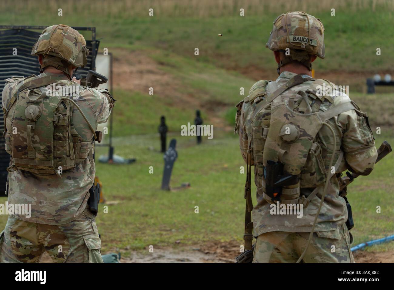 U.S. Army Staff Sgt. Brent Grafmuller, left, and 2nd Lt. Justin Baucom ...