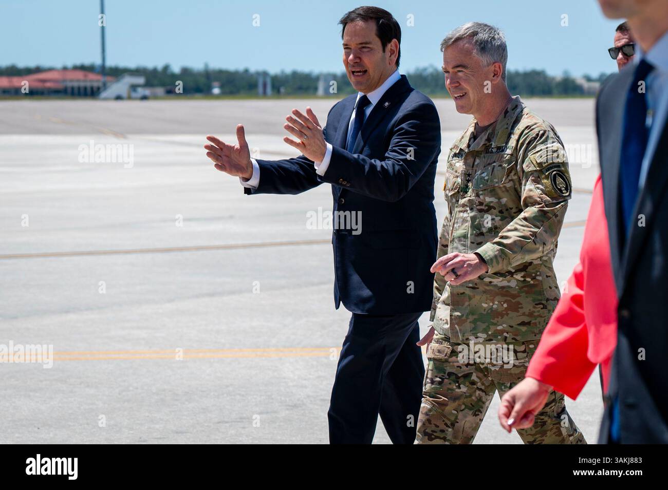 U.S. Secretary of State Marco Rubio walks with U.S. Army Gen. Byran ...