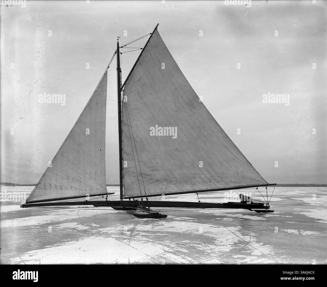 An iceboat sails across the frozen surface of Lake Minnetonka, showcasing the winter recreation ...