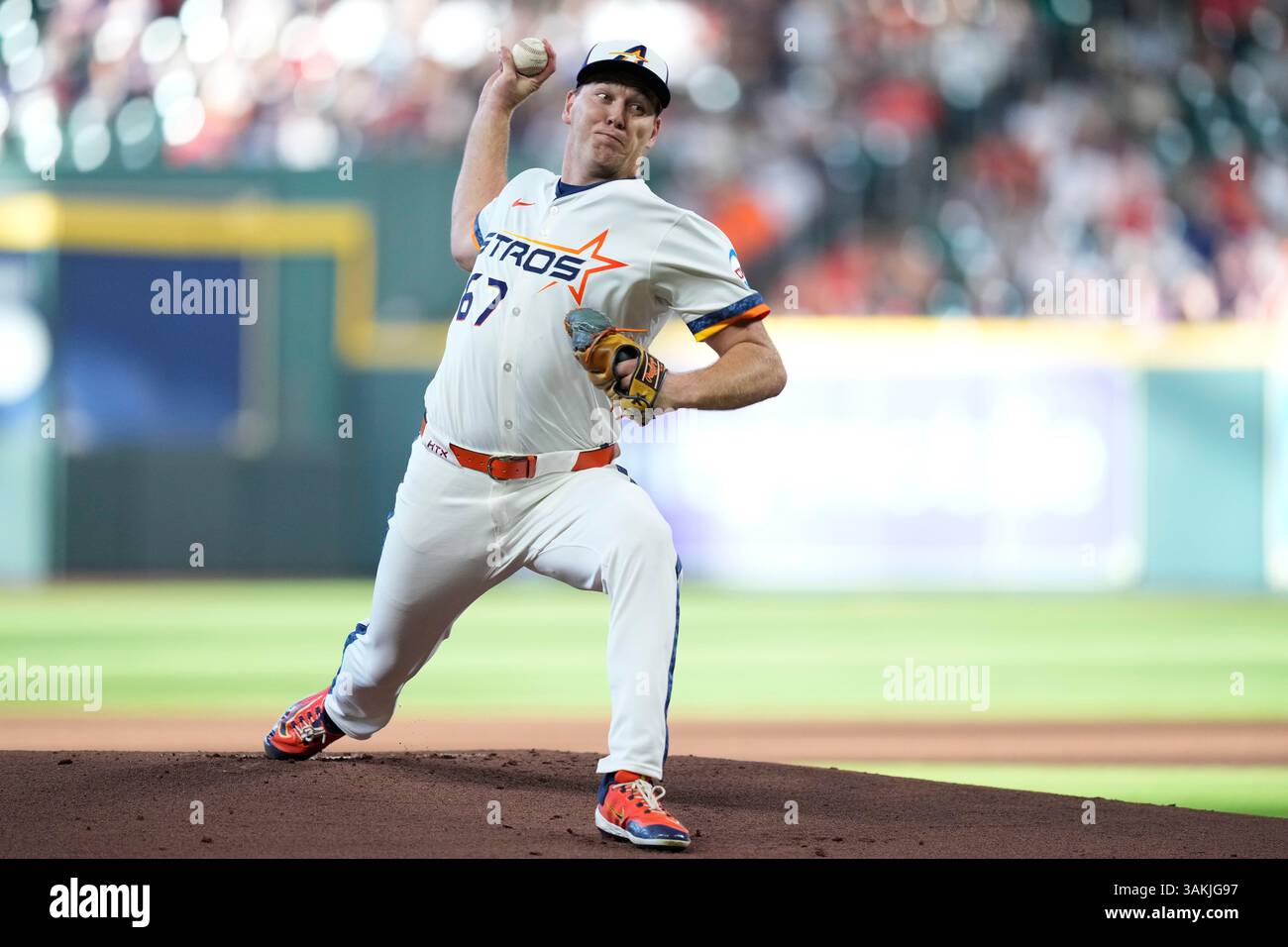 Houston Astros starting pitcher Ryan Gusto delivers during the first ...