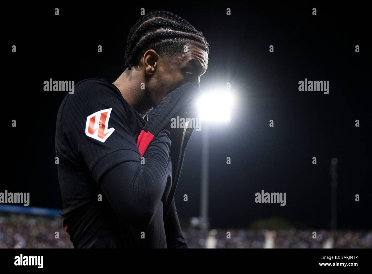 MADRID, SPAIN - April 12:Alejandro Balde of Barcelona is injured during ...
