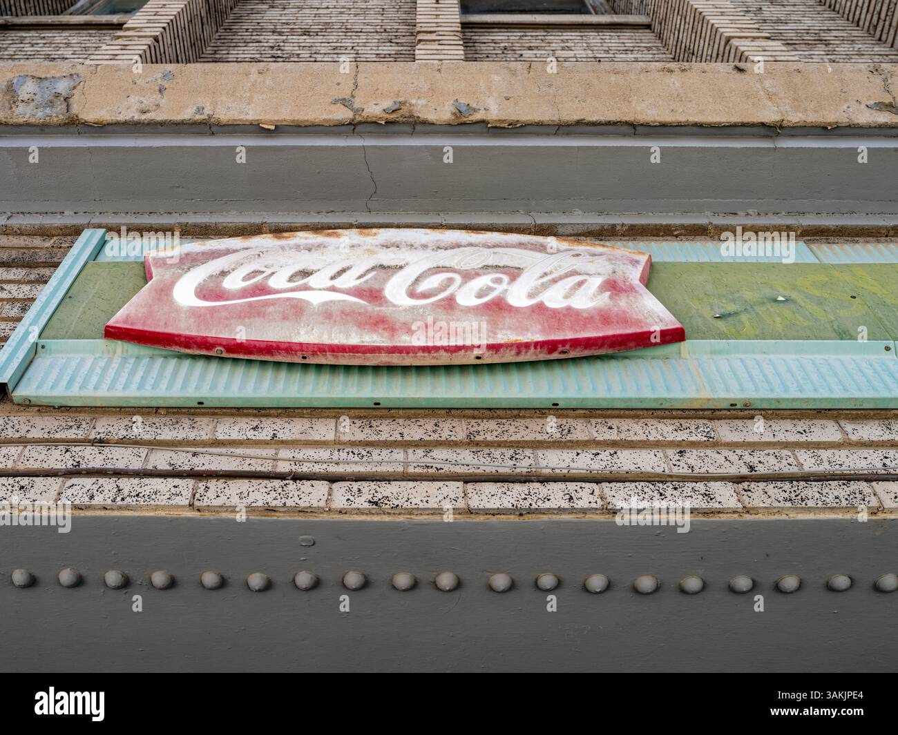 A faded Coca-Cola sign on the exterior wall of the old Milford Hotel in ...