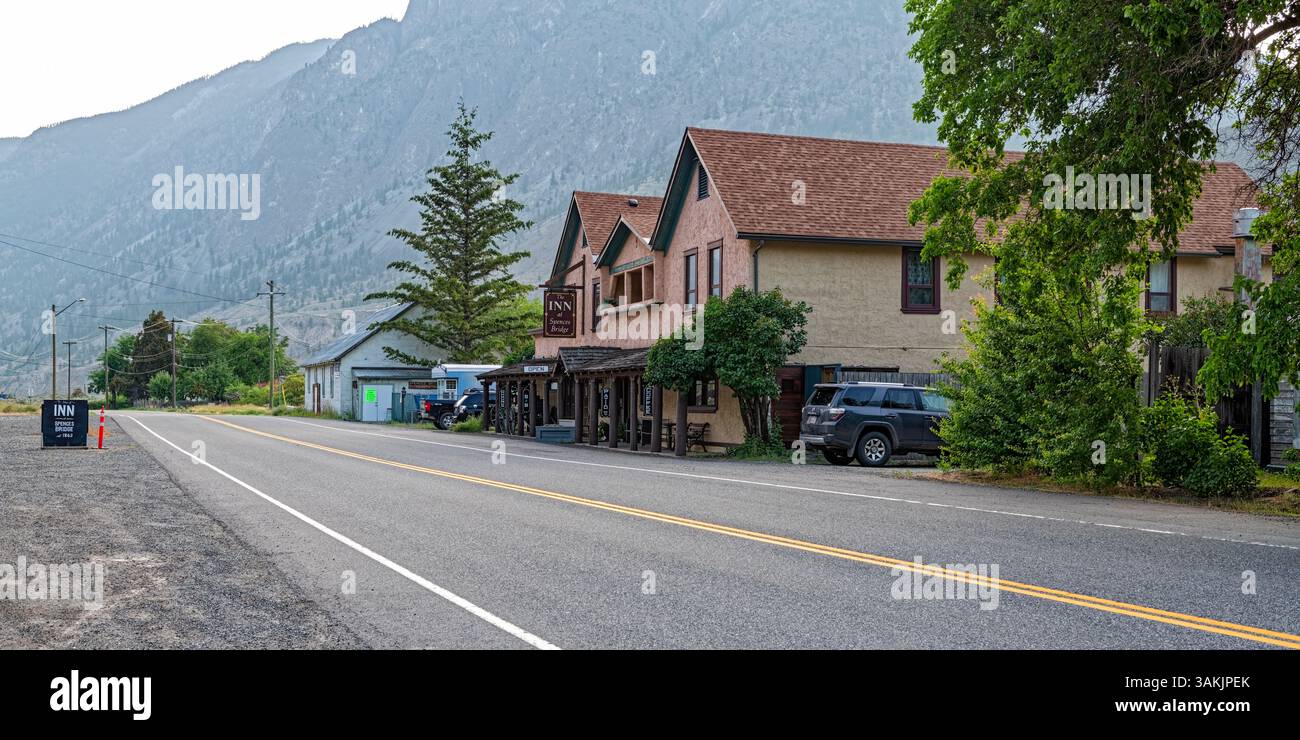 The Inn at Spences Bridge faces the highway below the mountains in ...