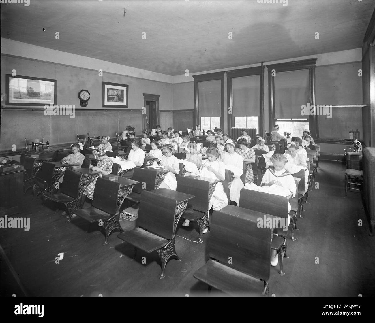 This image depicts a sewing class in progress at Sheridan School ...