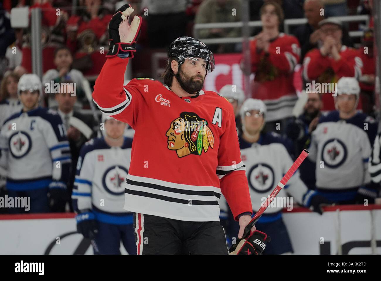 Chicago Blackhawks left wing Patrick Maroon acknowledges a standing ...