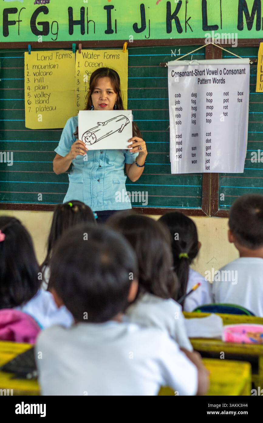 A public elementary school teacher in Batangas, Philippines teaches her ...
