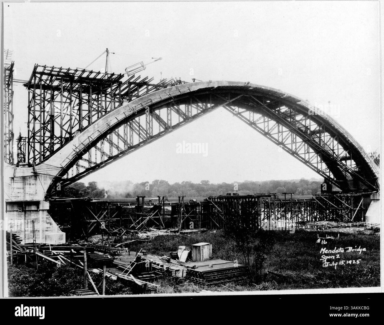 The Mendota Bridge under construction shows the completed arch ribs and ...
