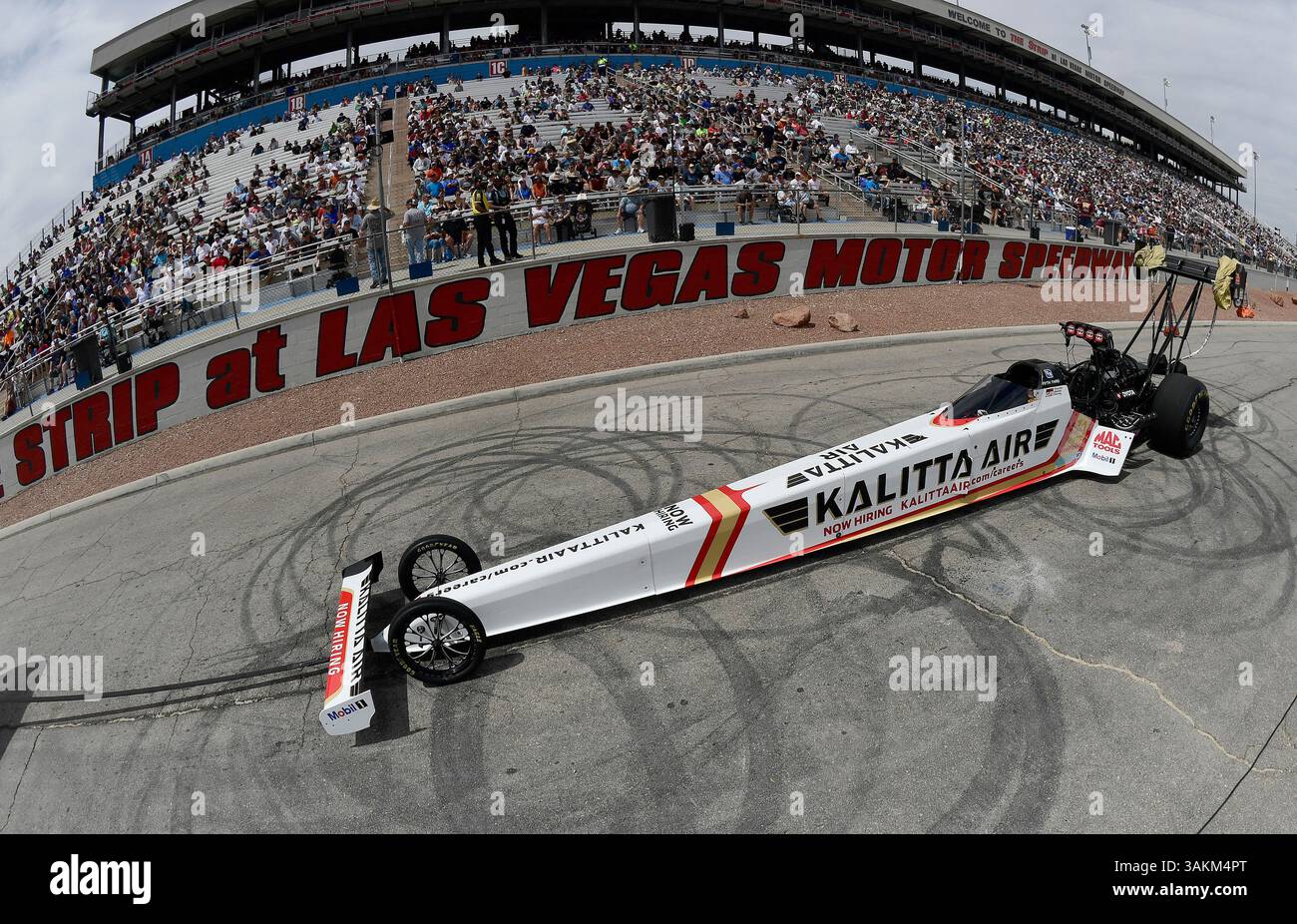 LAS VEGAS, NV - APRIL 12: The crew of Top Fuel driver Shawn Langdon tow ...