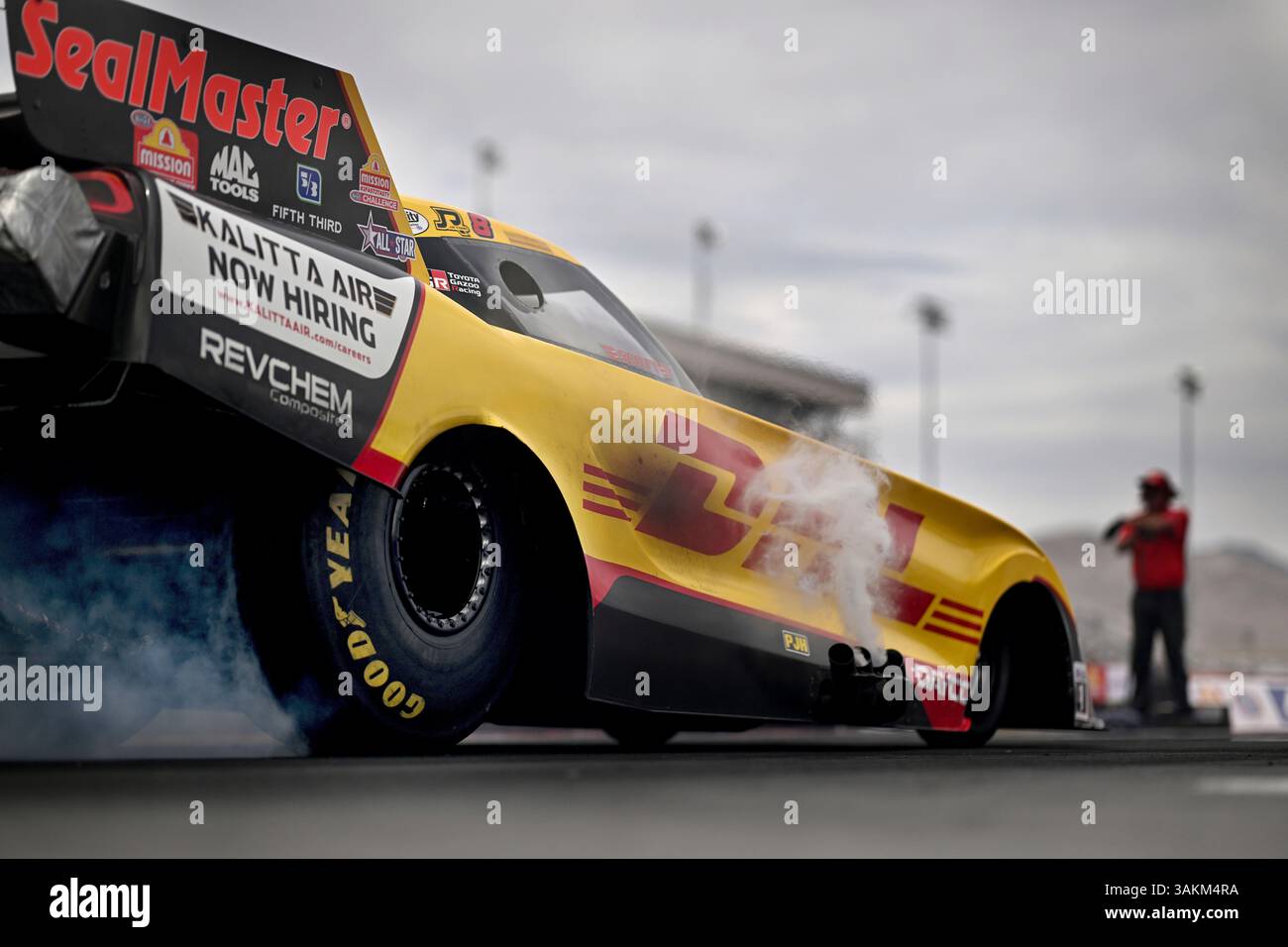 LAS VEGAS, NV - APRIL 12: Funny Car driver J.R. Todd does his burnout ...