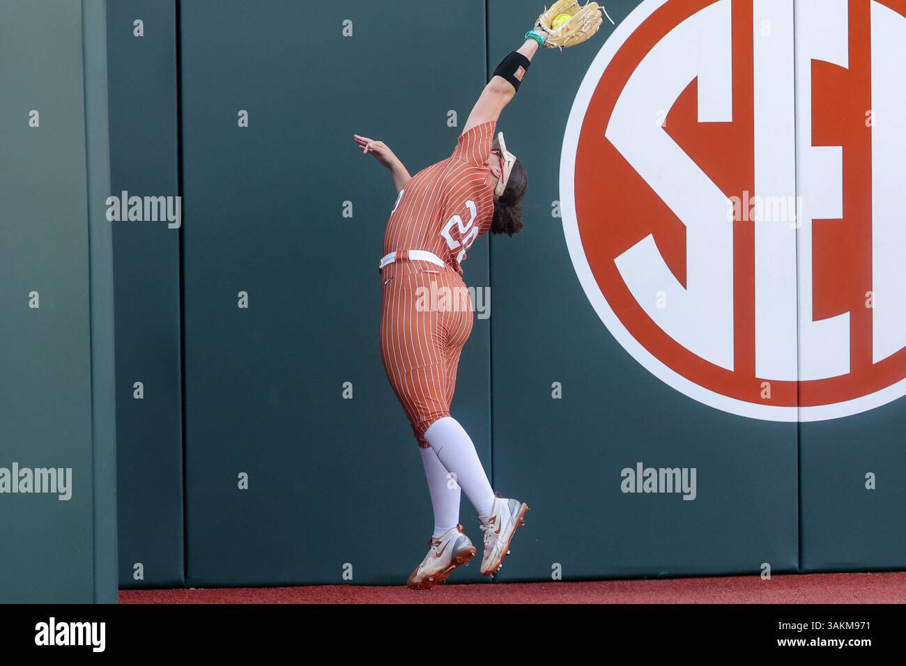 AUSTIN, TX - APRIL 12: Texas utility Katie Stewart (20) catches a fly ...