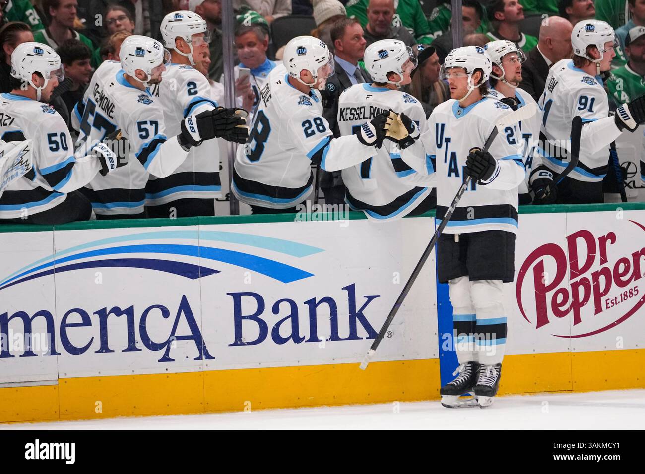 Utah Hockey Club Center Barrett Hayton Skates By His Bench After