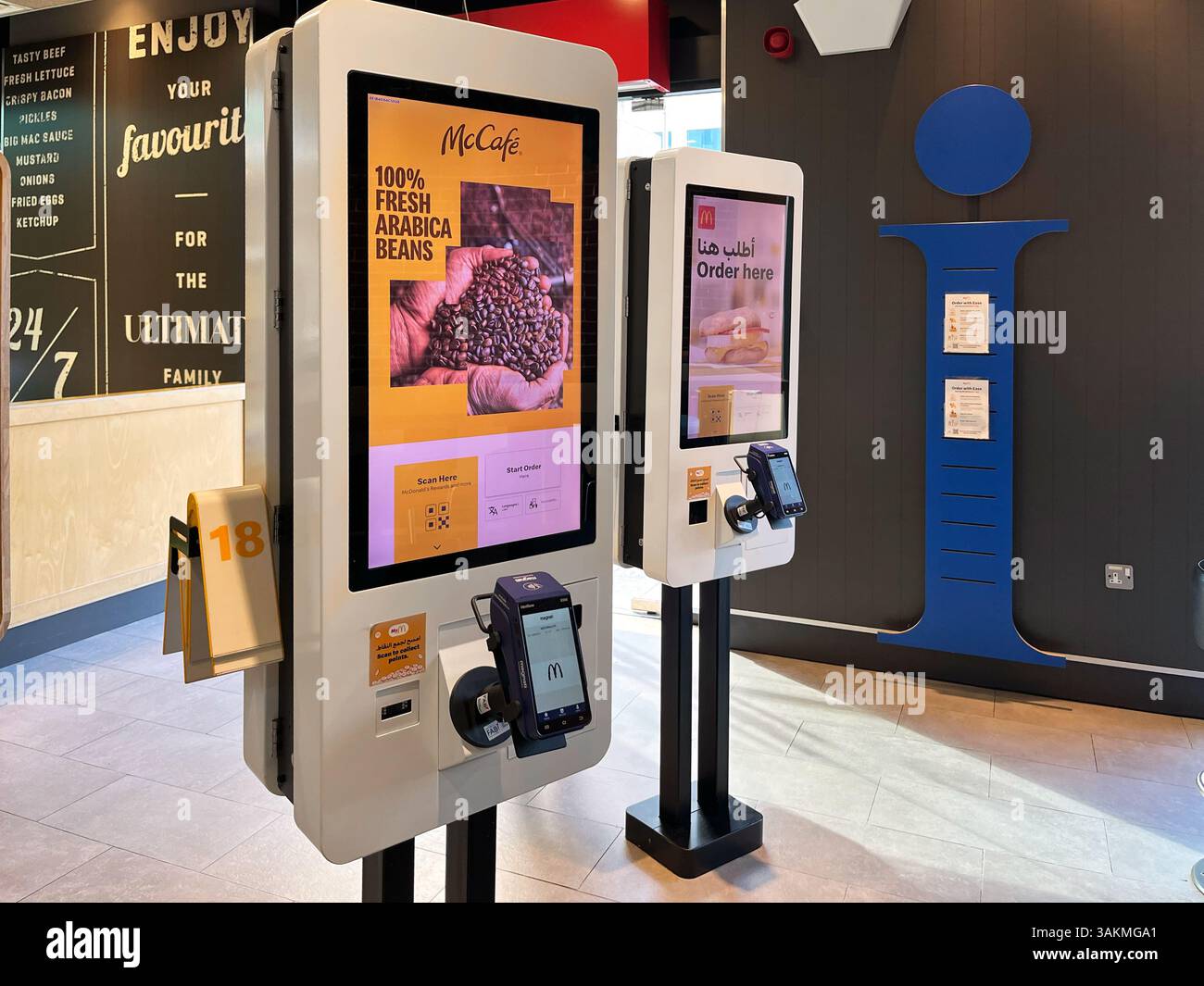 Self-service ordering kiosks in McDonald's restaurant payment terminals. Fast food restaurant ...