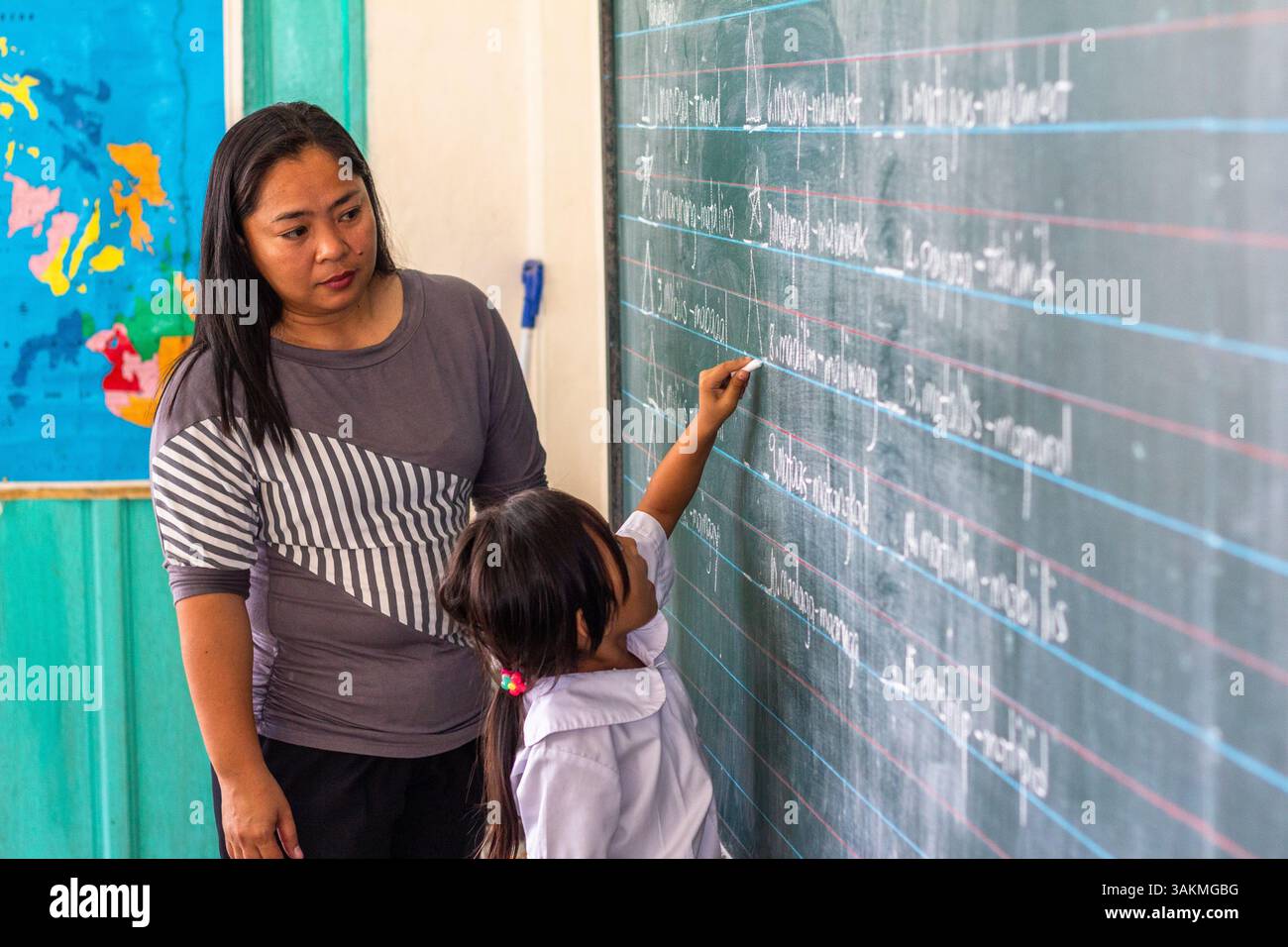 A public elementary school teacher in Batangas, Philippines teaches her ...