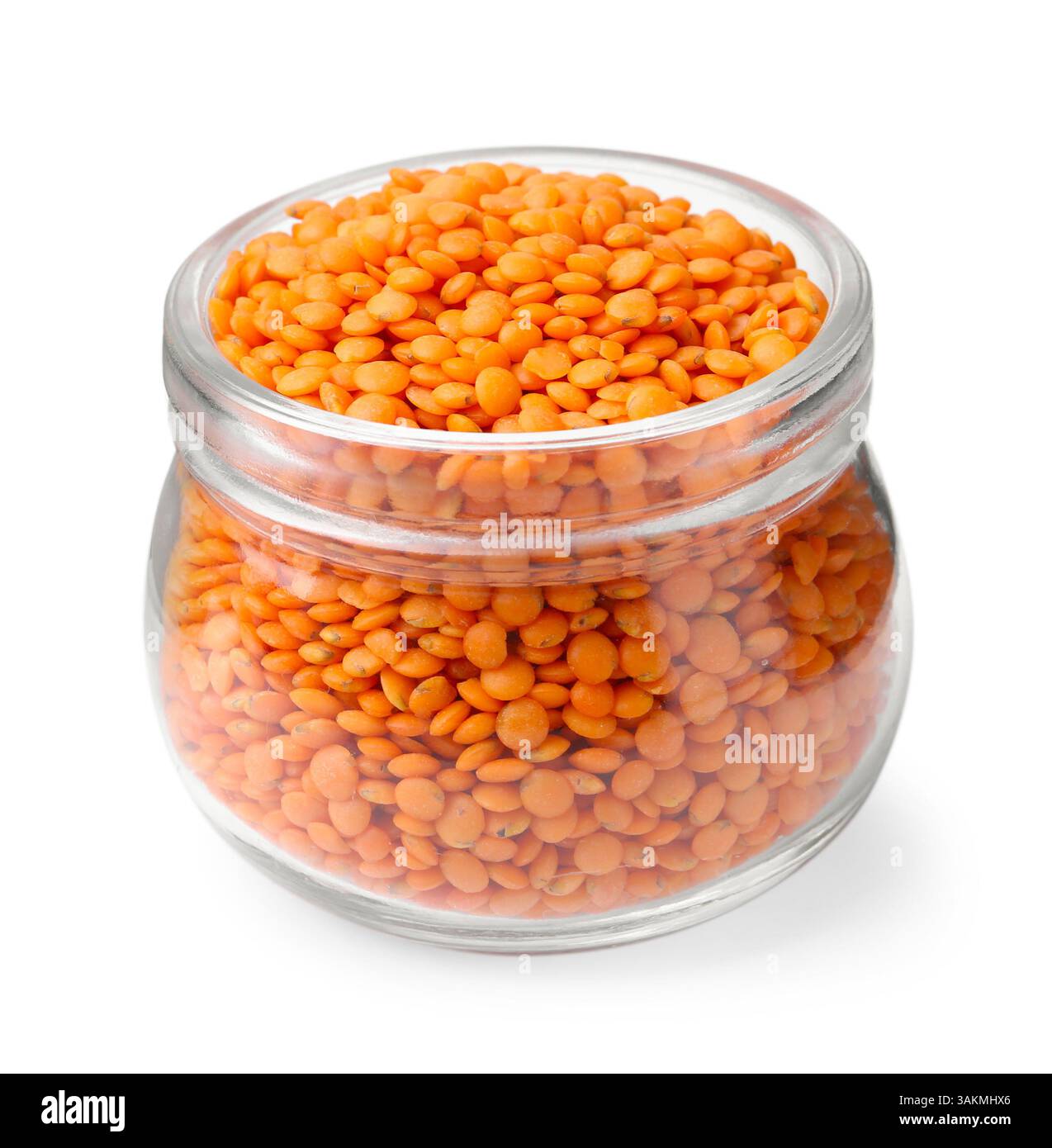 Raw lentils in glass jar isolated on white Stock Photo - Alamy