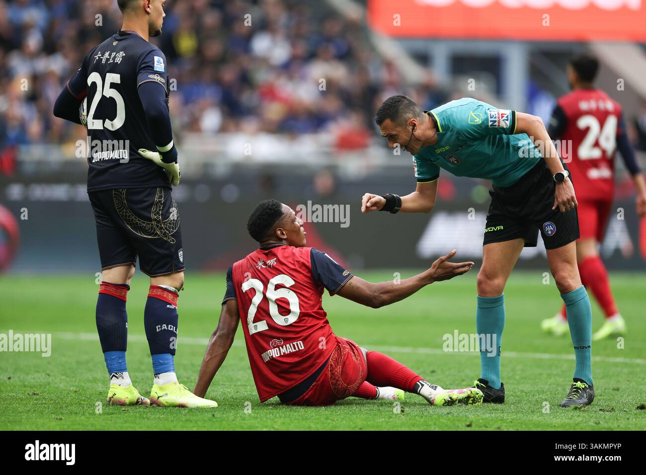 Milan, Italy. 12th Apr, 2025. Cagliari's Yerry Mina (C) talks with the ...