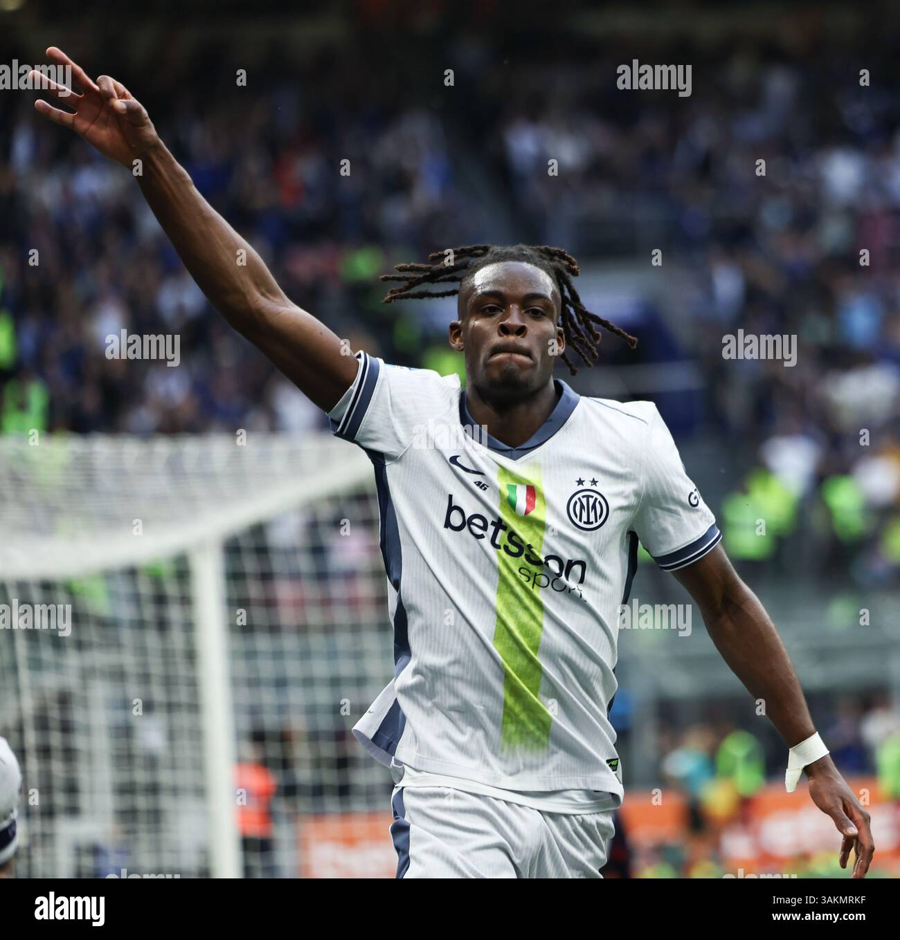 Milan, Italy. 12th Apr, 2025. Inter Milan's Yann Bisseck celebrates his ...