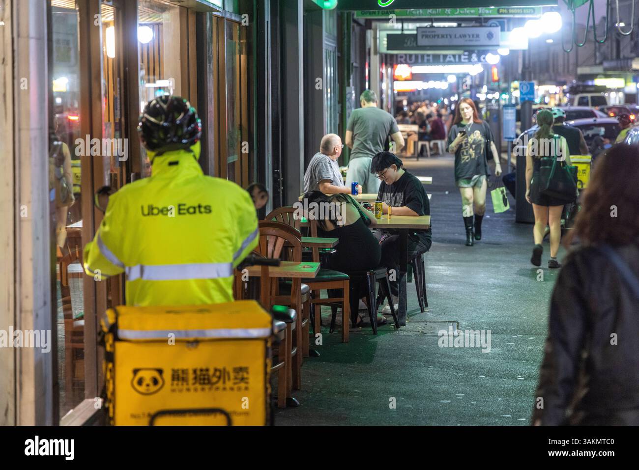 Newtown Sydney, Uber Eats and Happy Panda food delivery rider outside ...