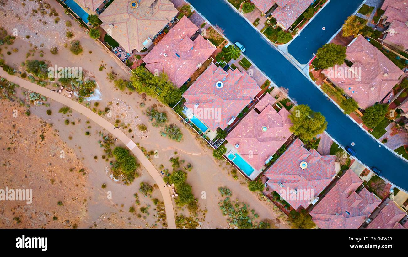 Aerial Top Down Suburban Desert Homes with Pools and Pathway in Warm ...