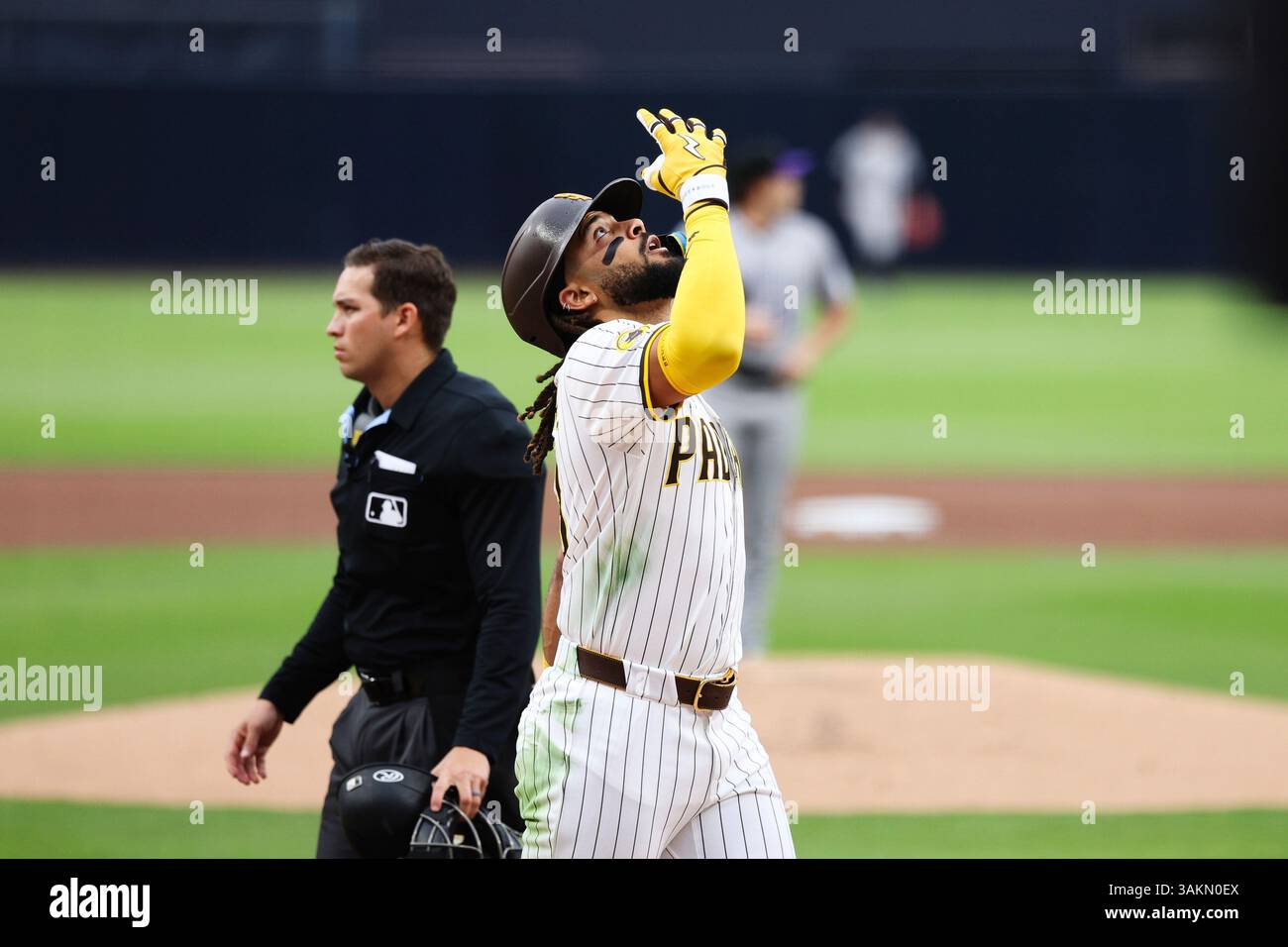 San Diego Padres' Fernando Tatis Jr. gestures towards the sky as he crosses home plate after ...