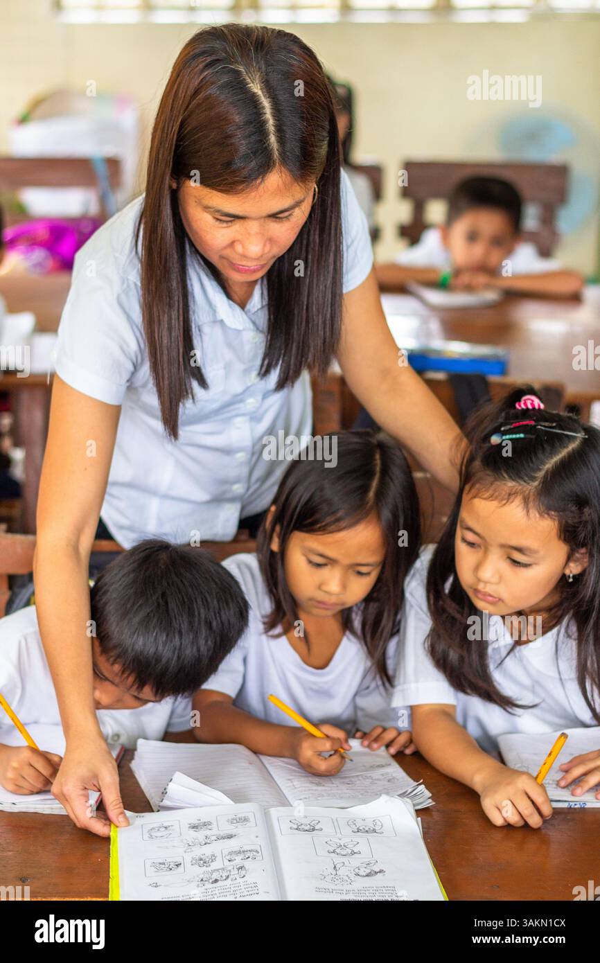 A public elementary school teacher in Batangas, Philippines teaches her ...