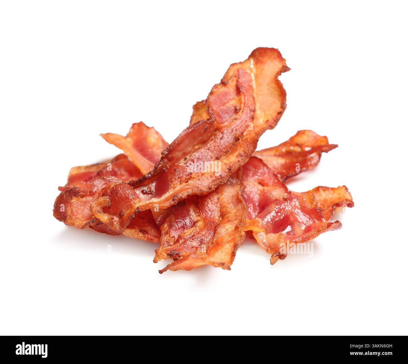 Fried bacon rashers on white background Stock Photo - Alamy