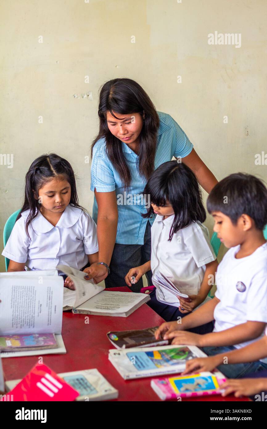 A public elementary school teacher in Batangas, Philippines teaches her ...