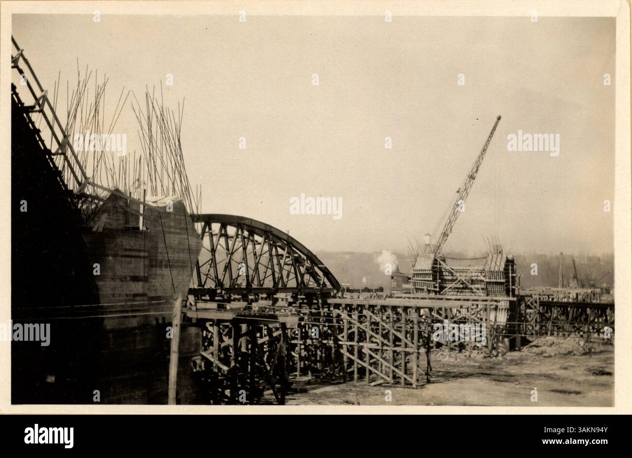 The image shows the ongoing construction of the Mendota Bridge, with ...