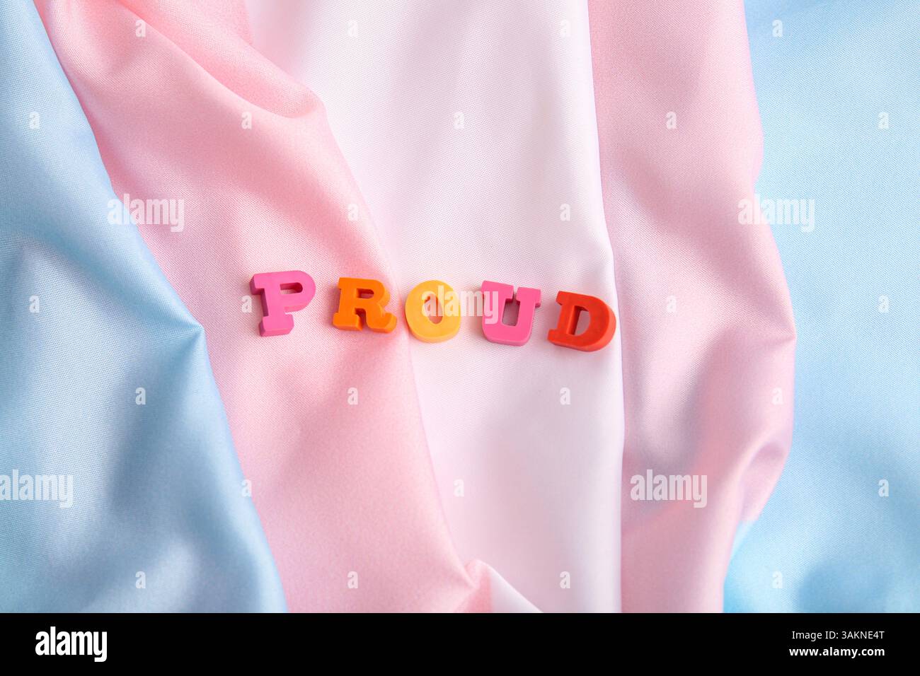 Transgender flag with word PROUD Stock Photo - Alamy