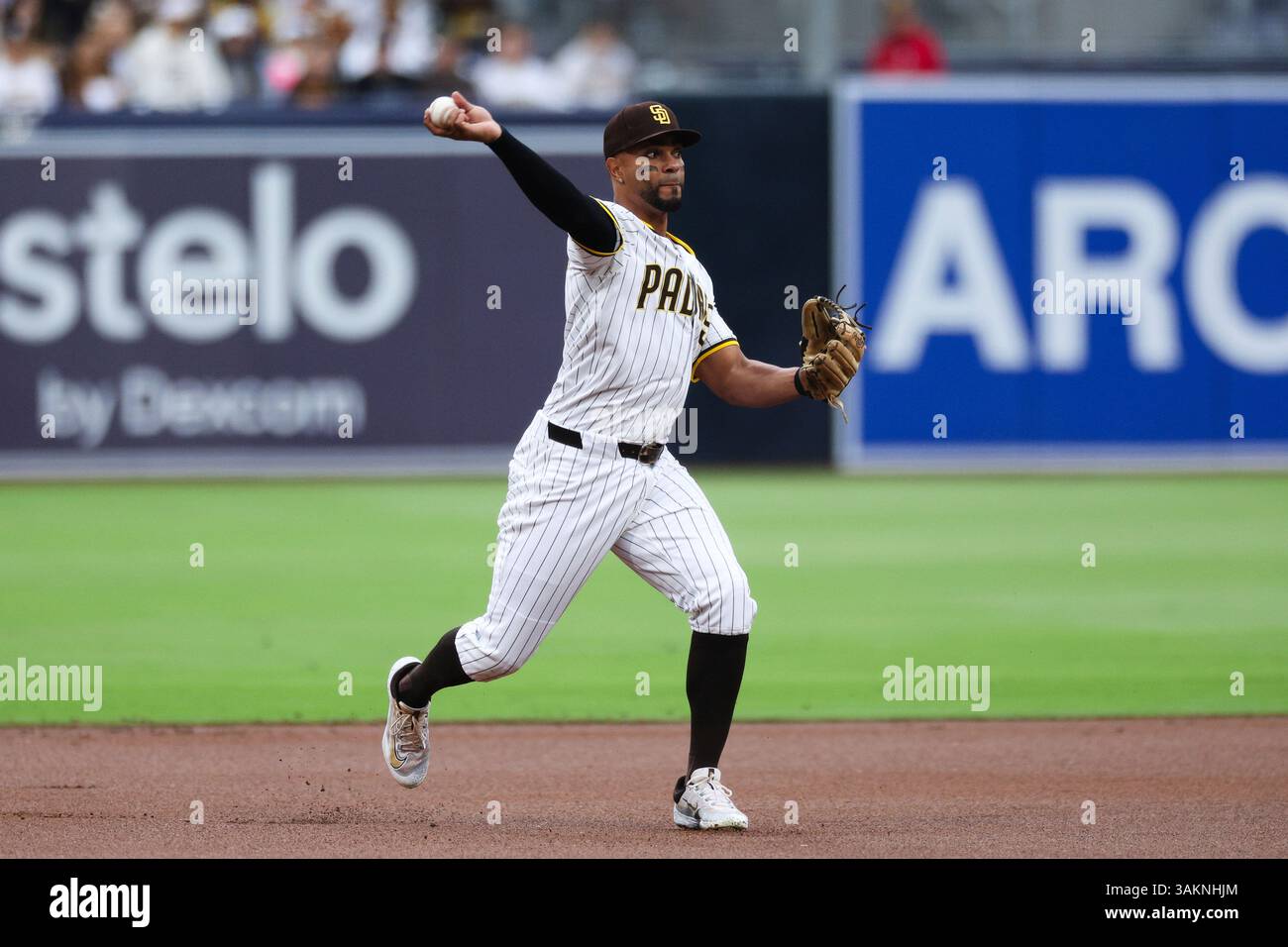 San Diego Padres shortstop Xander Bogaerts throws to first base for an ...
