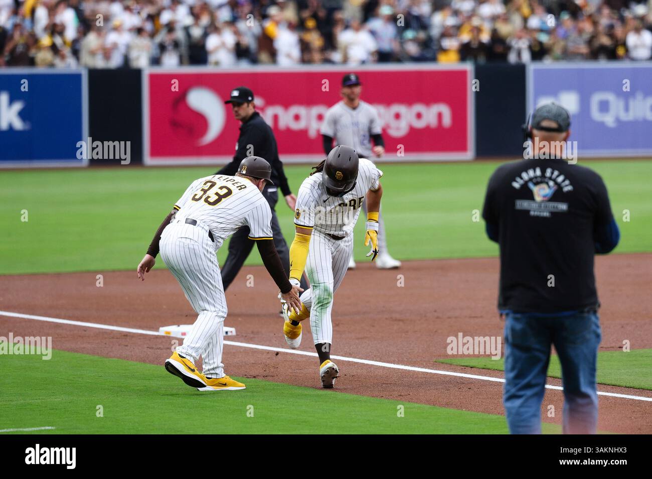 San Diego Padres' Fernando Tatis Jr., right, celebrates with third base ...