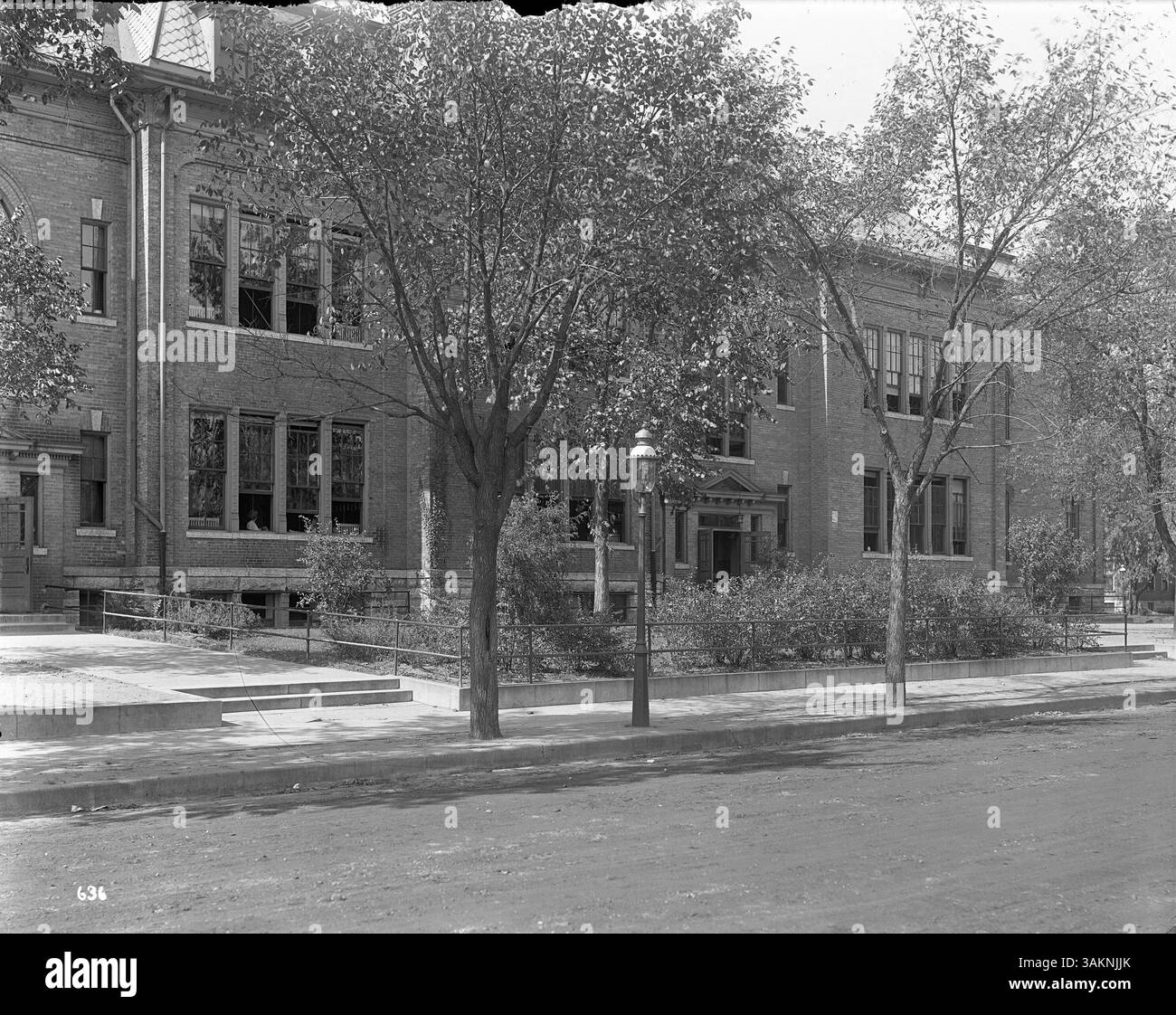 The photo of Adams School highlights the exterior of the building ...