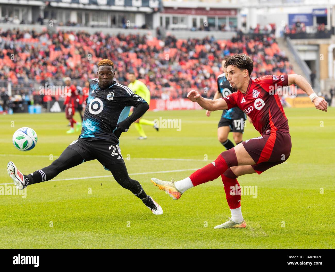 Toronto. 12th Apr, 2025. Theo Corbeanu (R) of Toronto FC shoots during ...