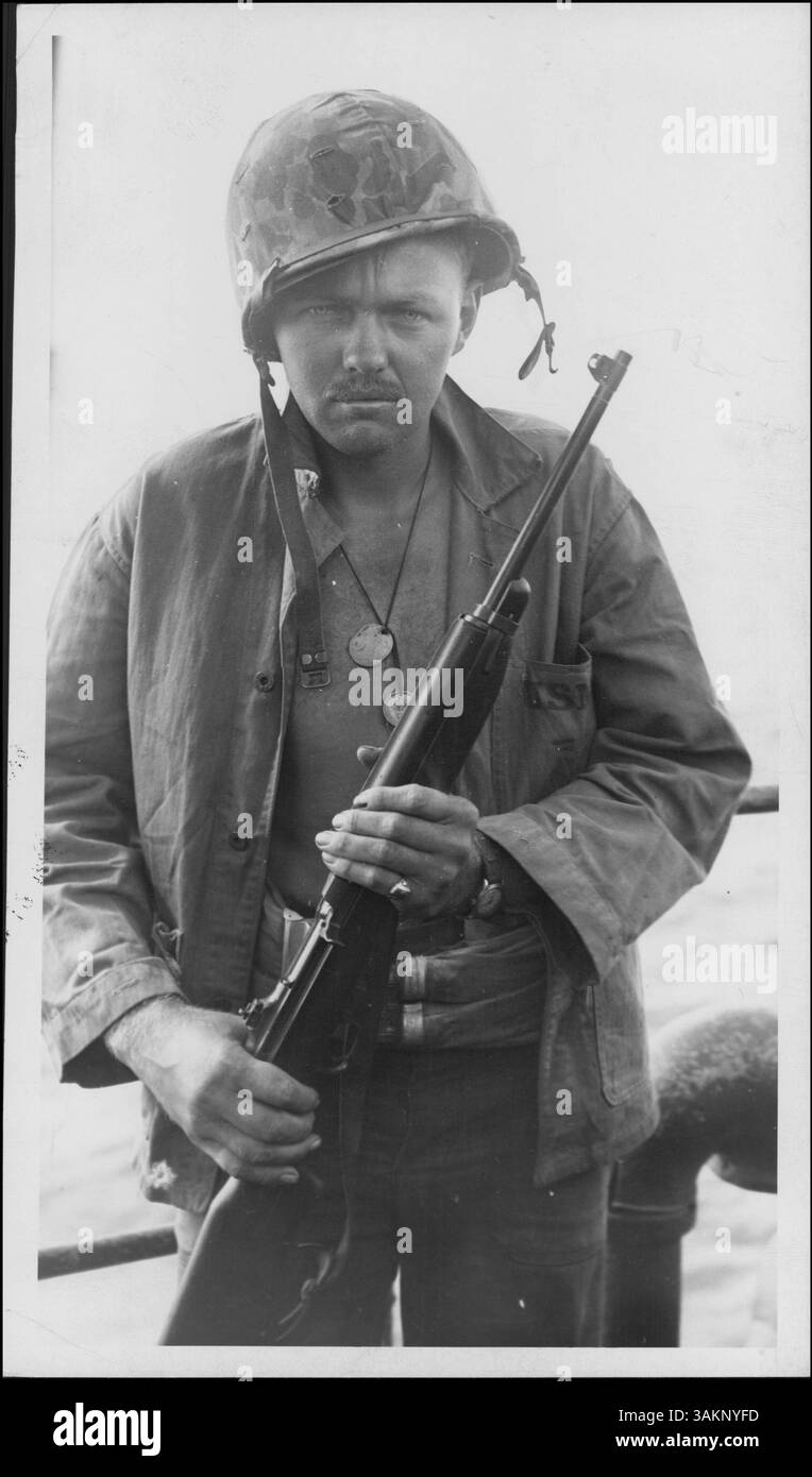 Marine Sergeant Milton Nolte, from Fairmont, is shown holding a rifle ...