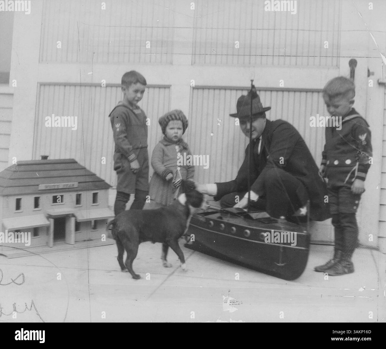 Stanley McCormick, along with his children and family dog, is pictured ...