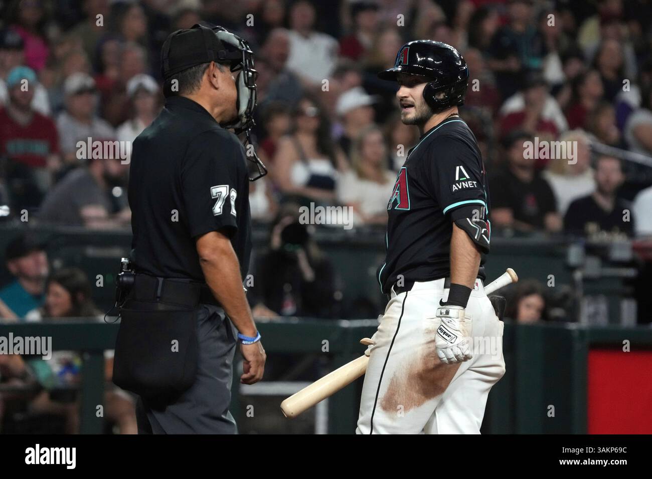 Arizona Diamondbacks' Garrett Hampson talks to home plate umpire ...