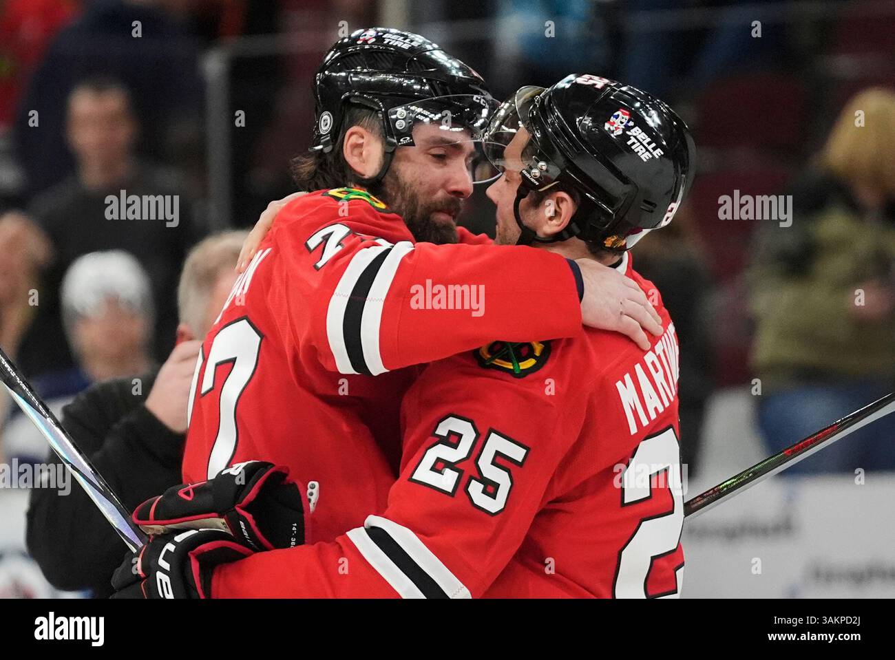 Chicago Blackhawks left wing Patrick Maroon (77), left, and defenseman ...