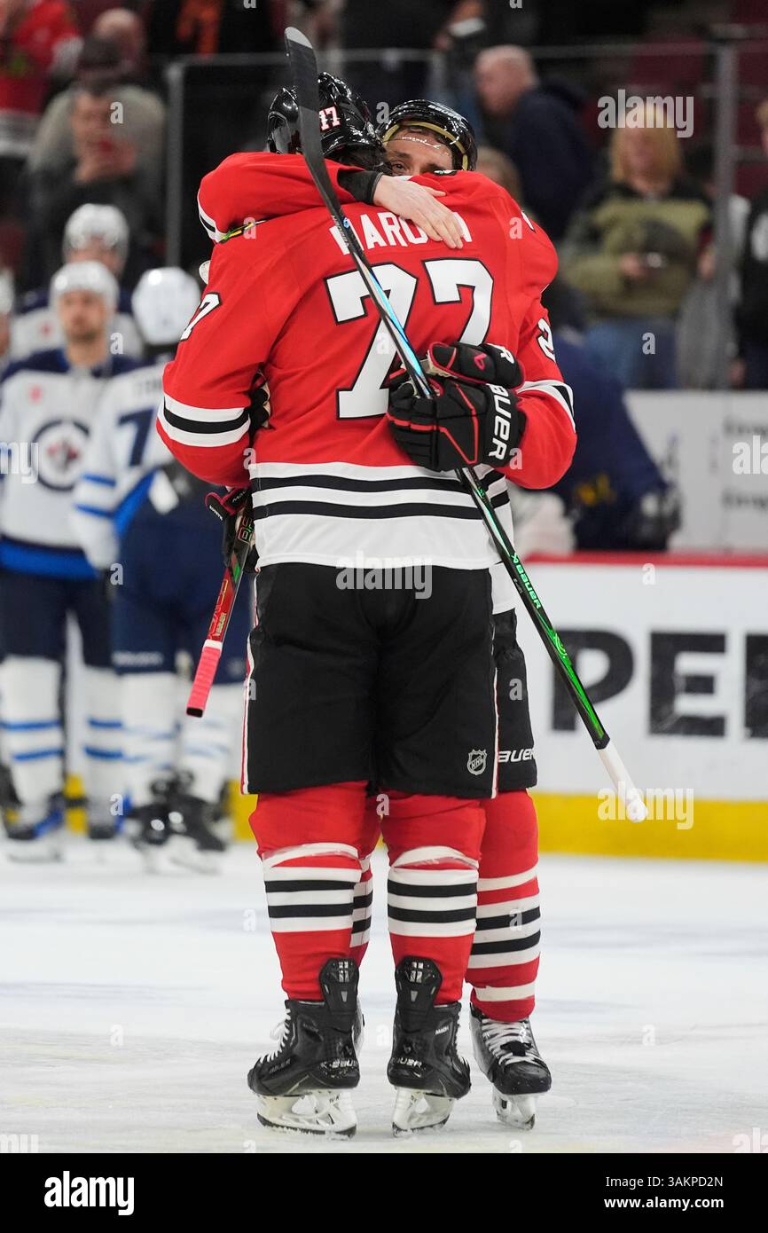 Chicago Blackhawks left wing Patrick Maroon (77), left, and defenseman ...