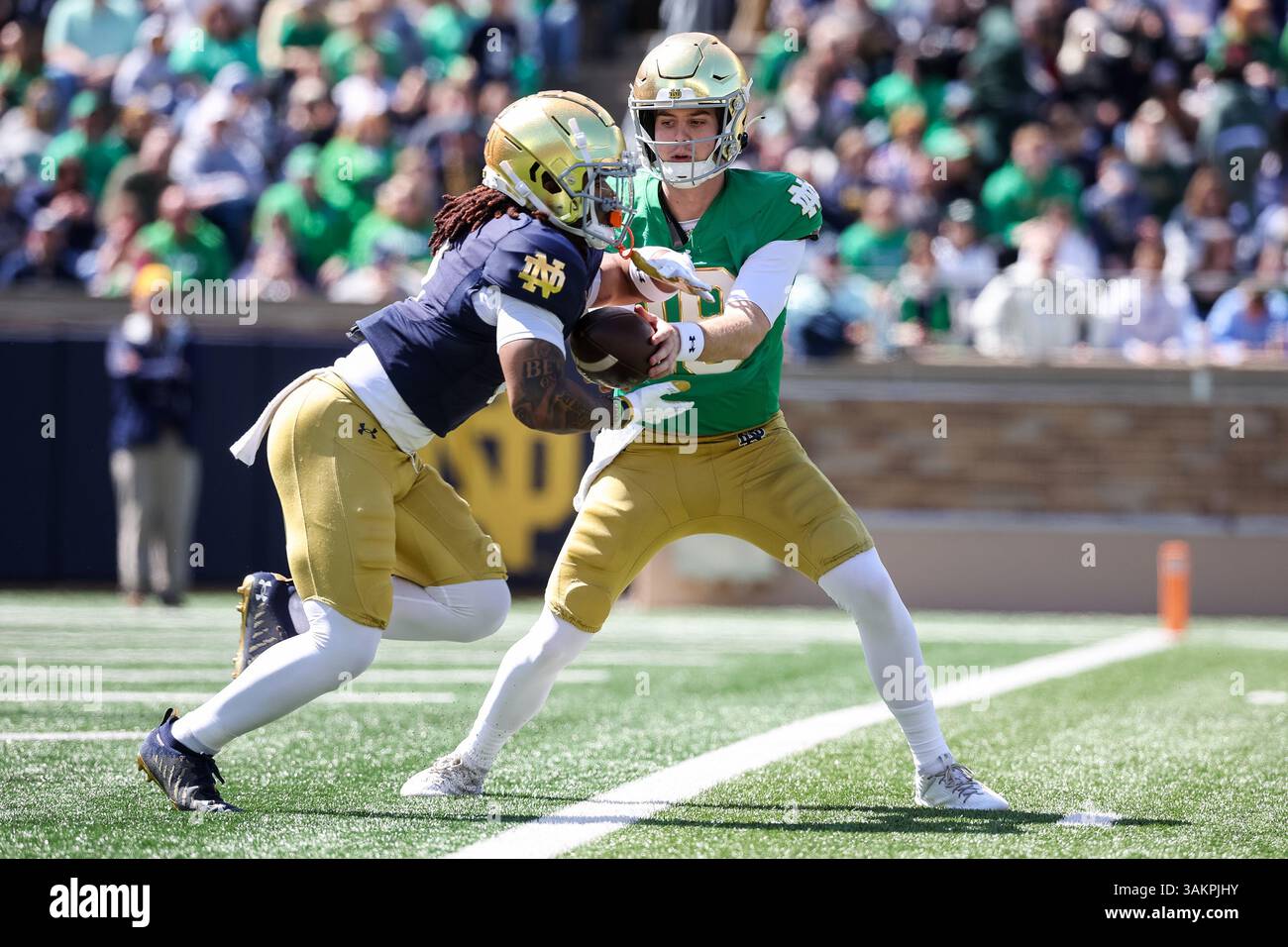 April 12, 2025: Notre Dame quarterback Steve Angeli (18) hands the ball ...