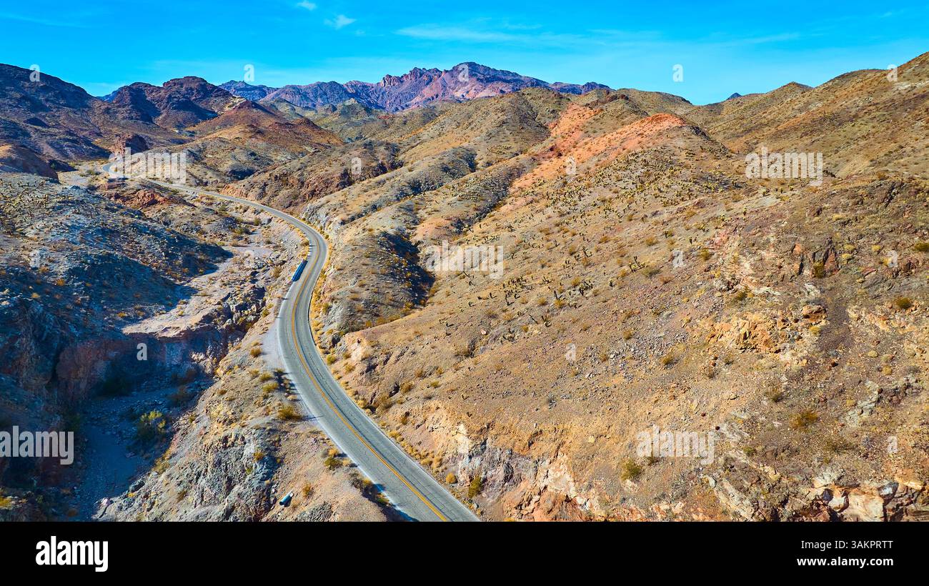 Aerial of Winding Desert Road with Mountain Backdrop in Nevada Stock ...