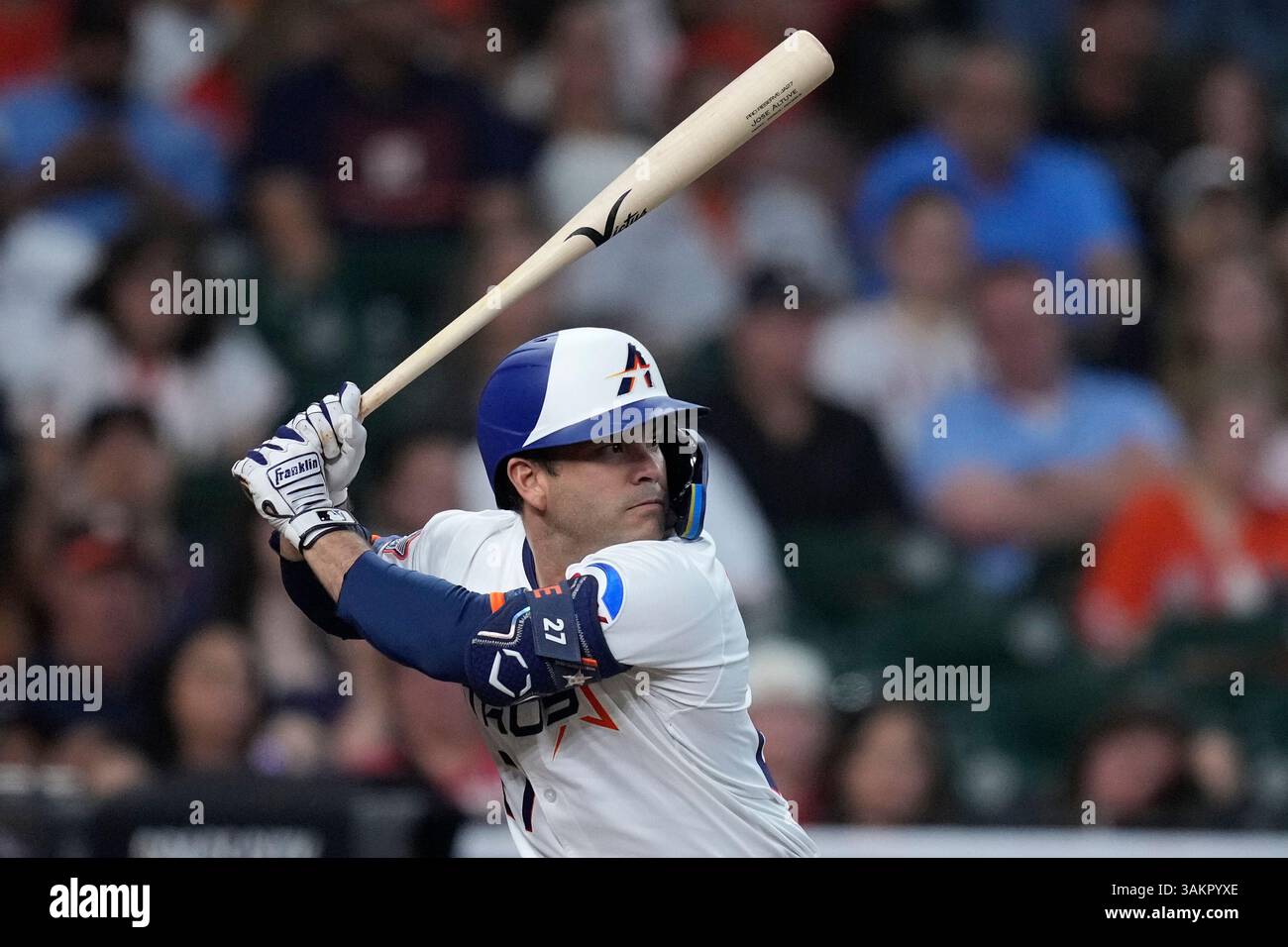 Houston Astros' Jose Altuve bats during the fifth inning of a baseball ...