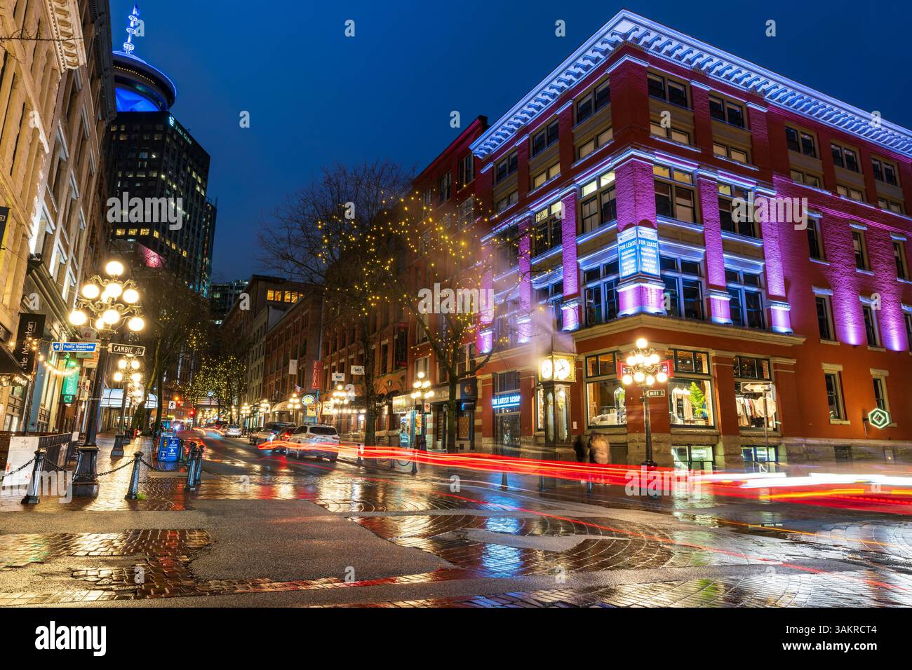 Gastown Steam Clock and downtown beautiful street view on a rainy night. Cambie and Water Street ...