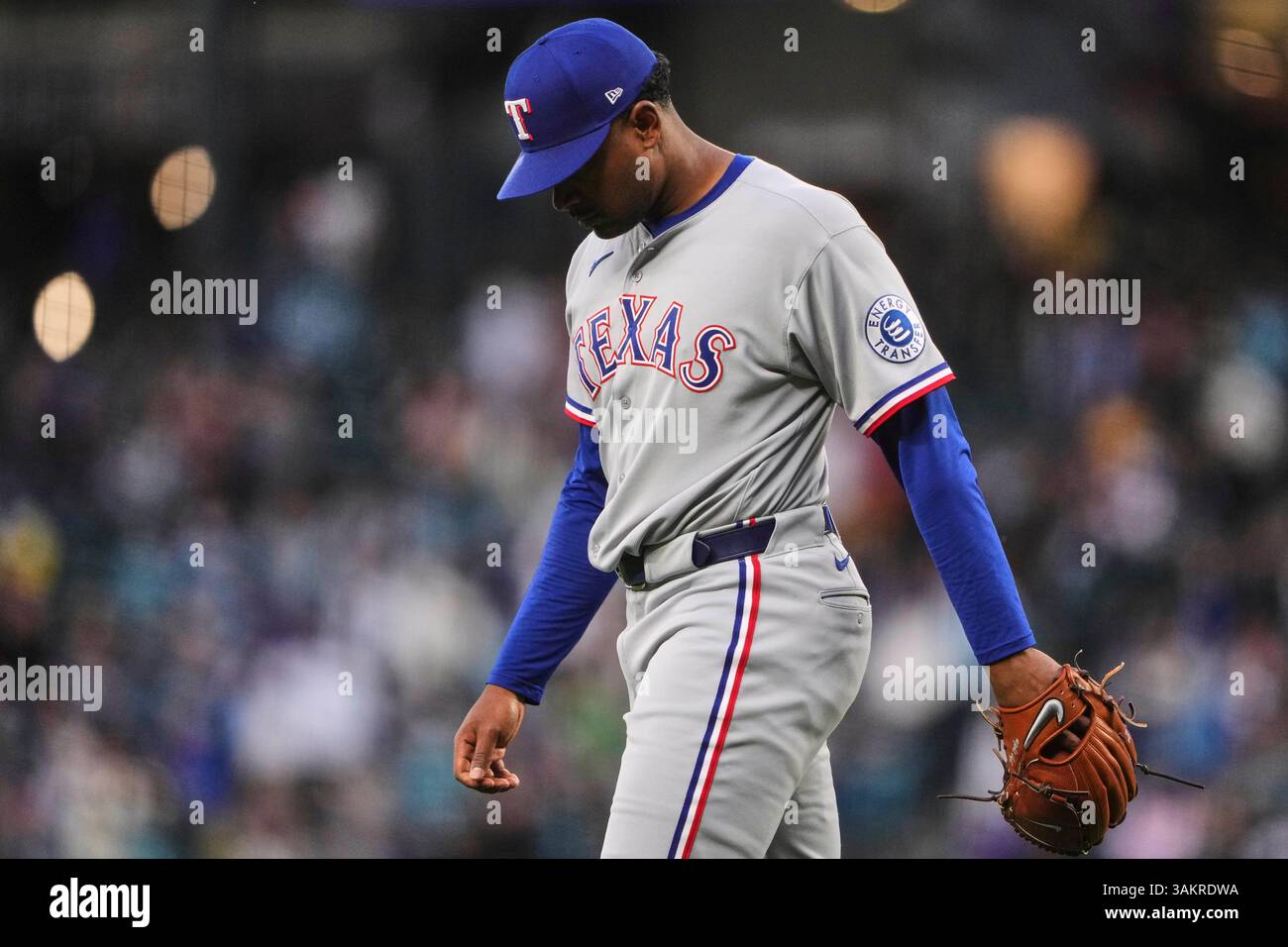 Texas Rangers starting pitcher Kumar Rocker reacts after an RBI double ...