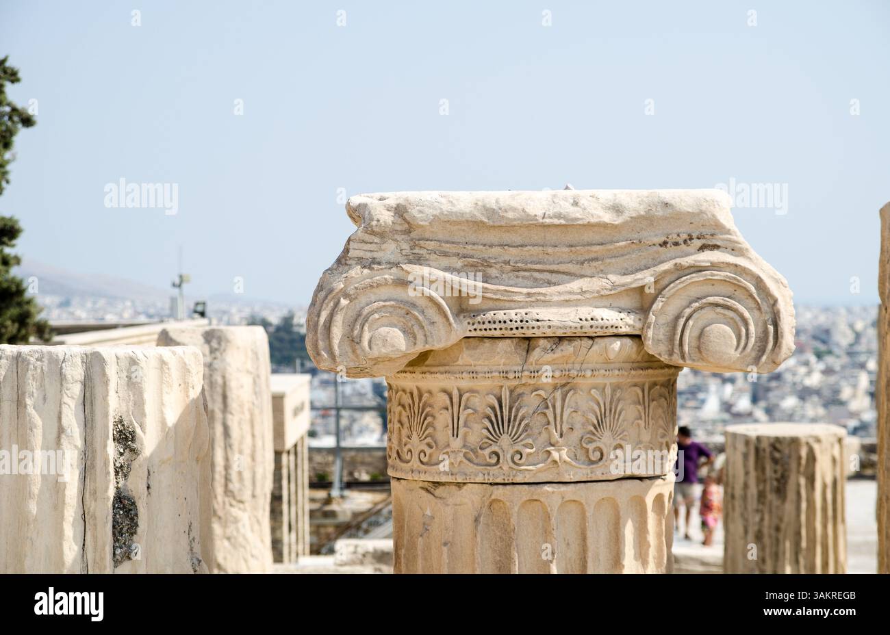 Marble ruins of an Ionic capital on top of a column in the Acropolis of ...