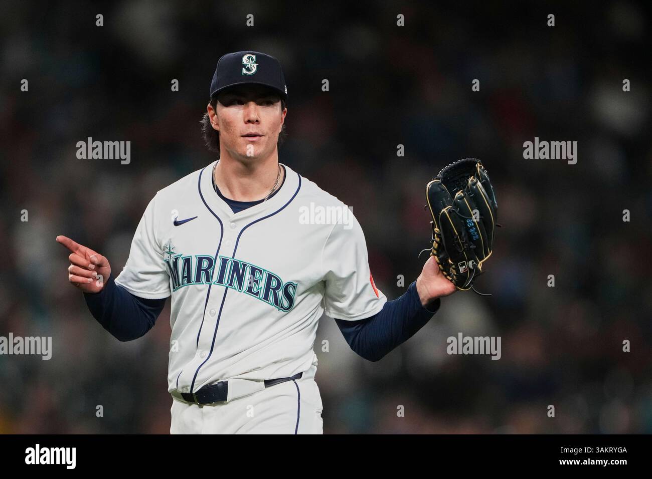 Seattle Mariners starting pitcher Bryan Woo reacts after the final out ...