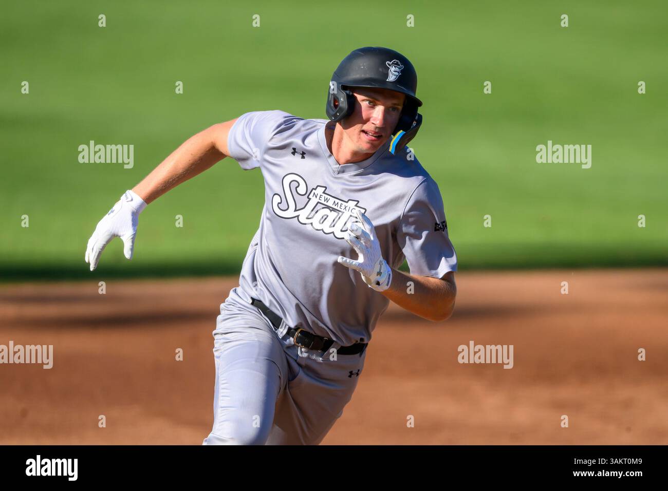 New Mexico State infielder Bryce Campbell (20) runs to home plate to ...