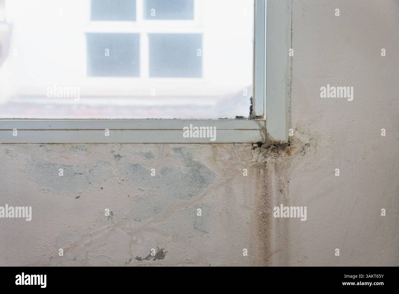 Windows leaking at the bottom corner of the frame Stock Photo - Alamy