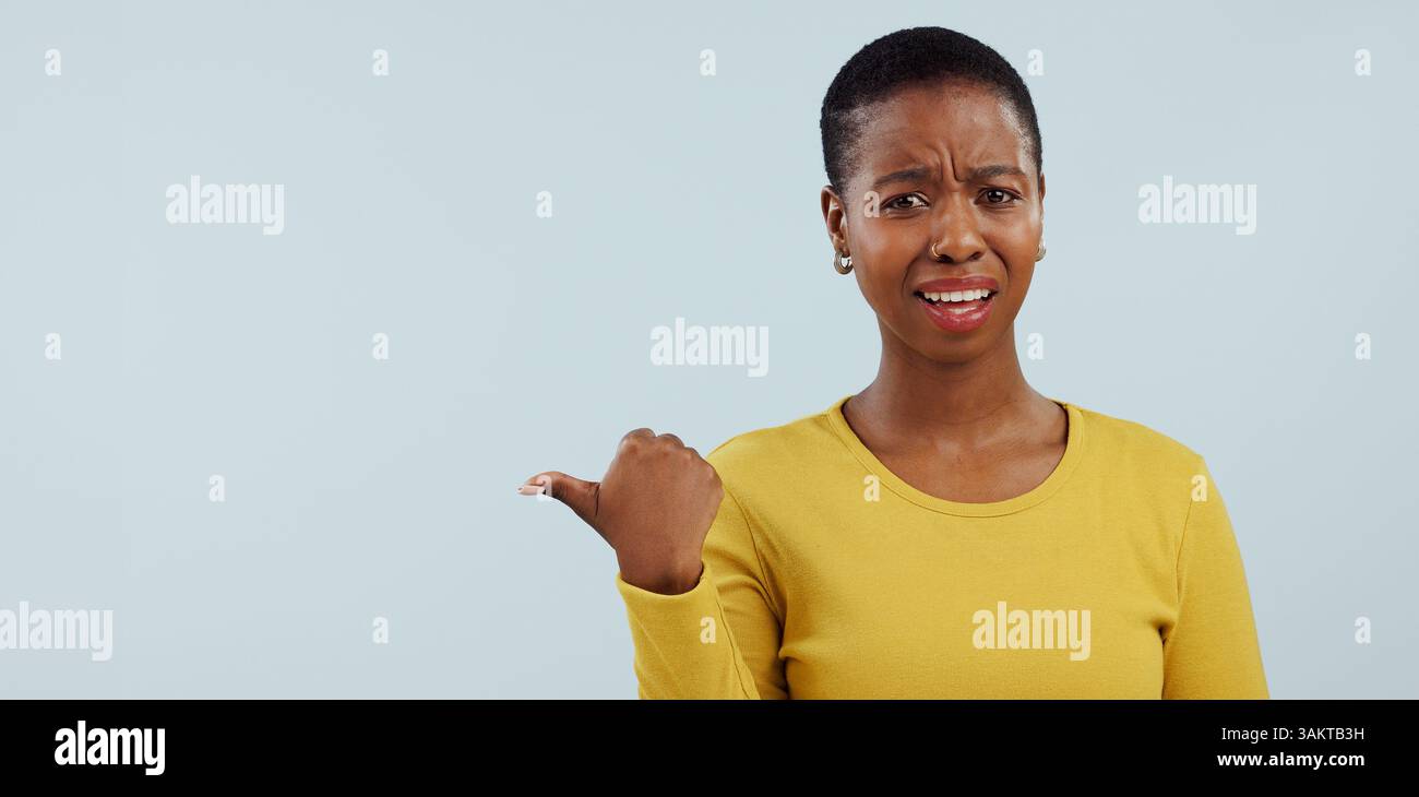 Confused, pointing and portrait of black woman in studio with why ...