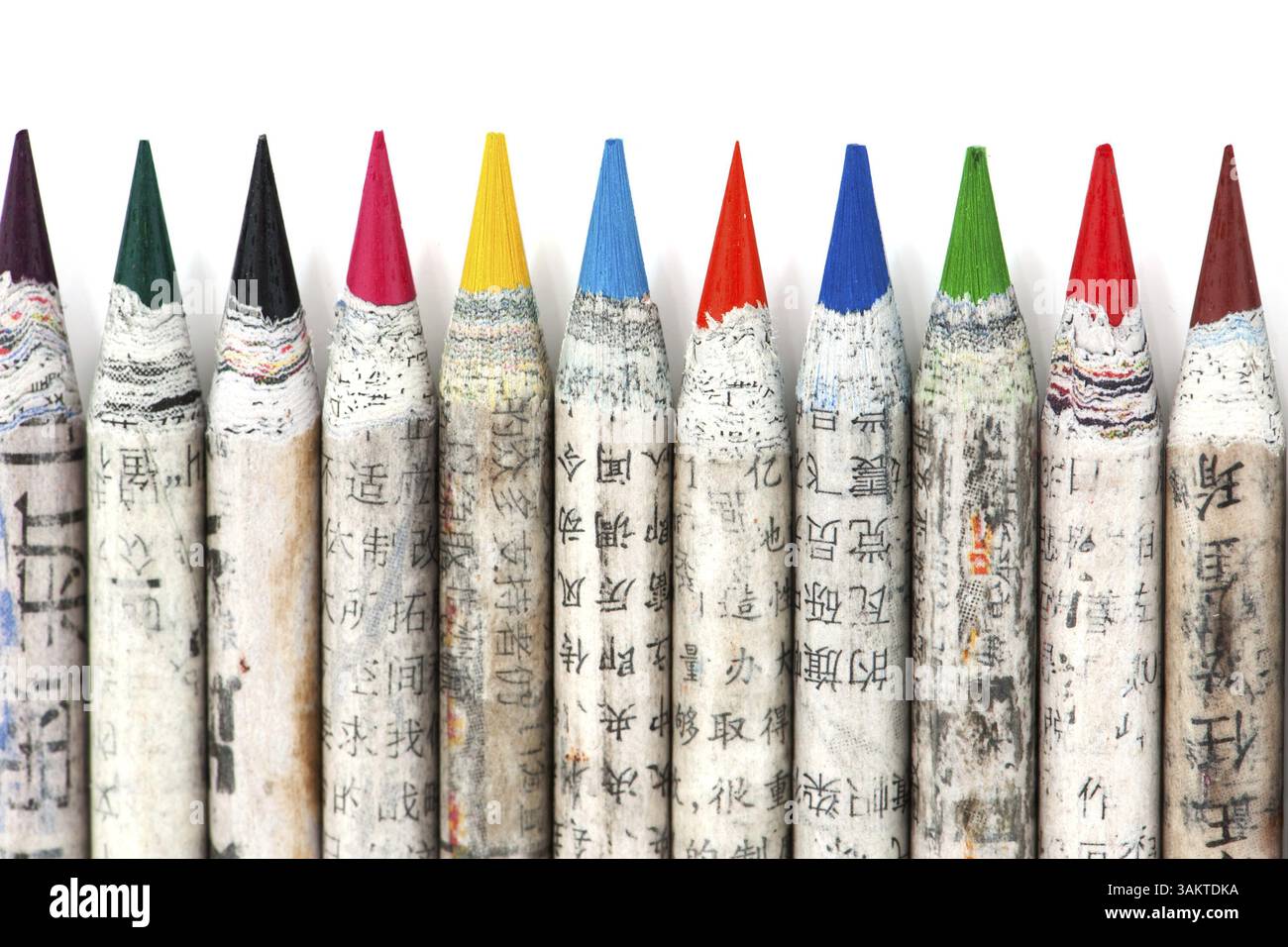 Chinese color pencils made from newspapers over white Stock Photo - Alamy
