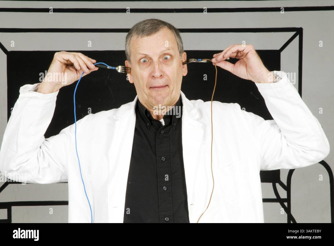 Nutty professor with electricity experiment Stock Photo - Alamy