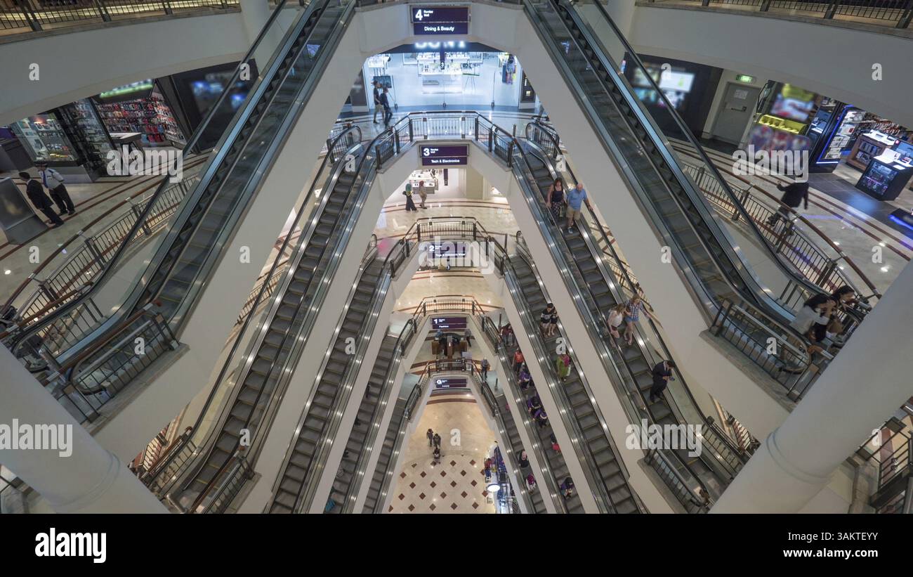 Timelapse high angle shot of modern multistorey shopping mall. People ...